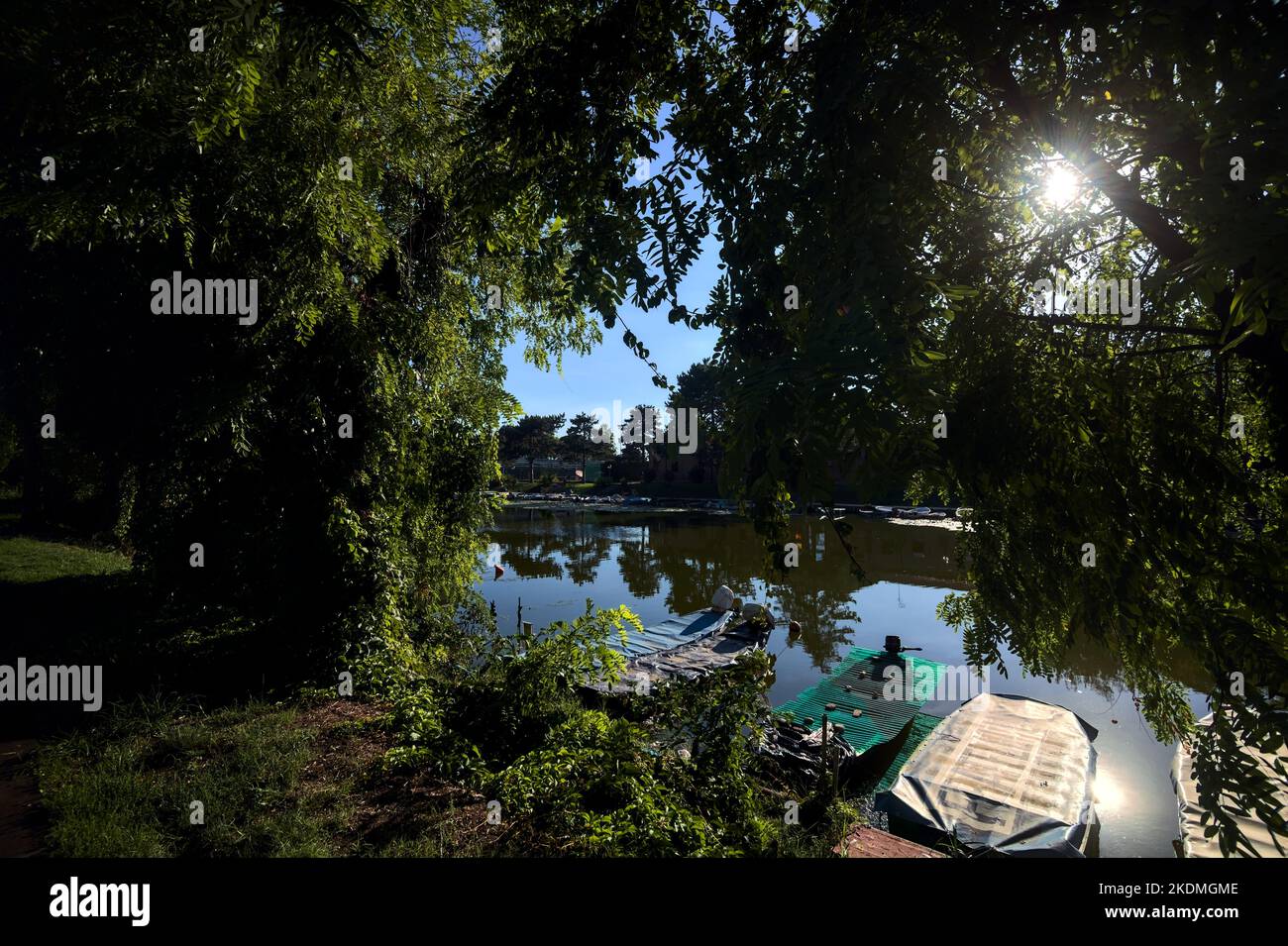 Pier in an inlet of a lake at sunset Stock Photo - Alamy