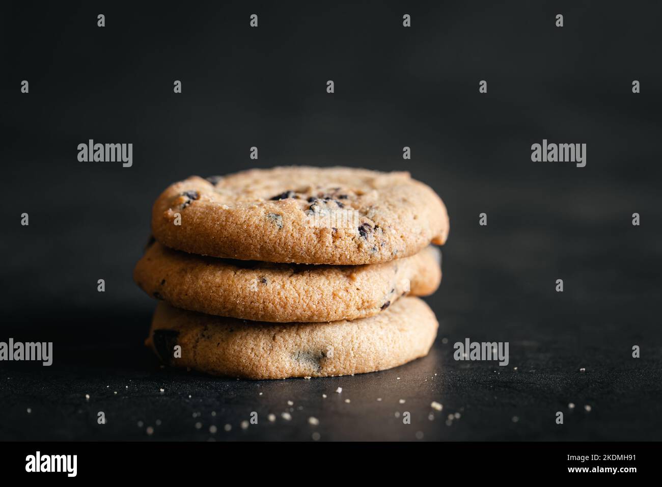 Chocolate chip cookies close up on a black background Stock Photo - Alamy