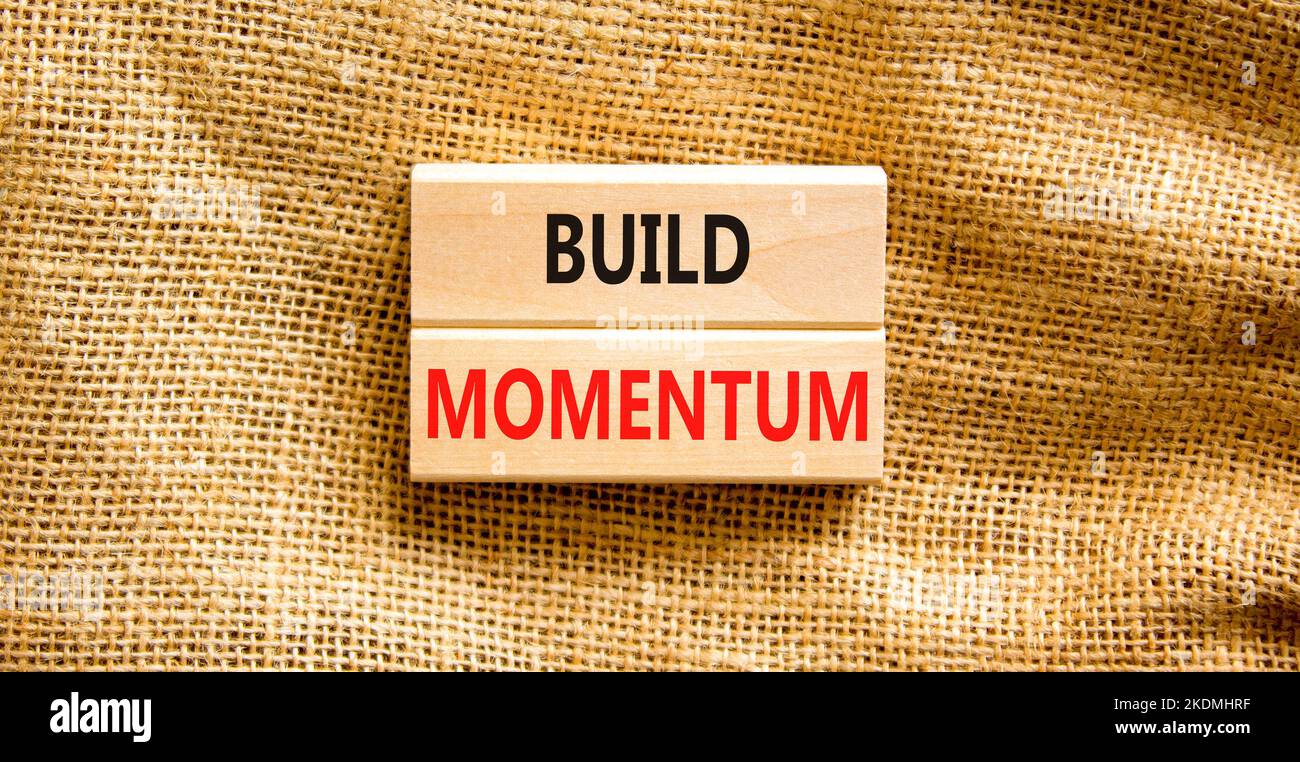 Build momentum symbol. Concept words Build momentum on wooden blocks ...