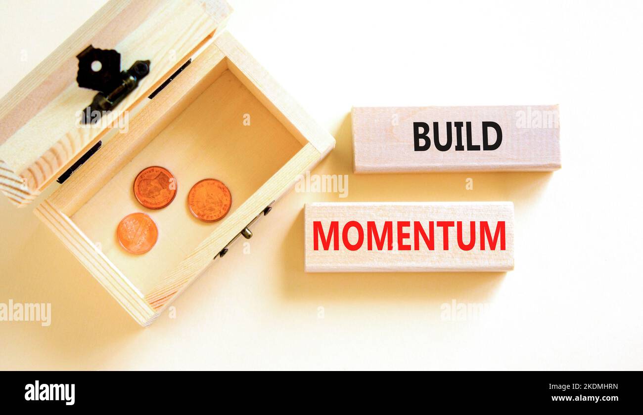 Build momentum symbol. Concept words Build momentum on wooden blocks ...