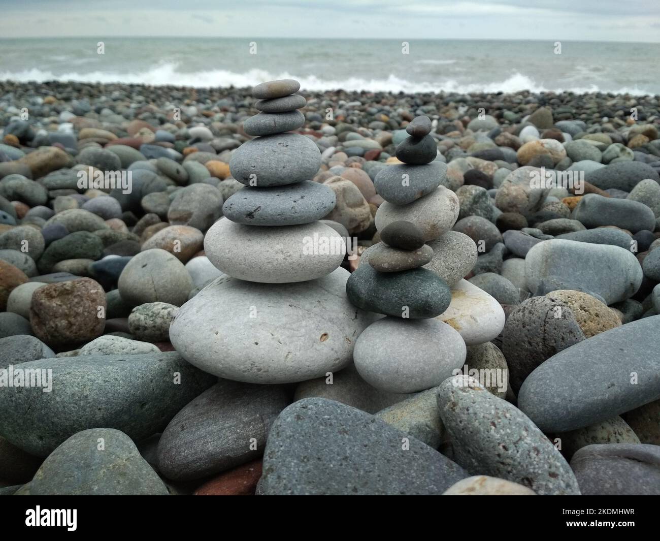 harmony of balance. A tower of stacks of stones lie on top of each ...