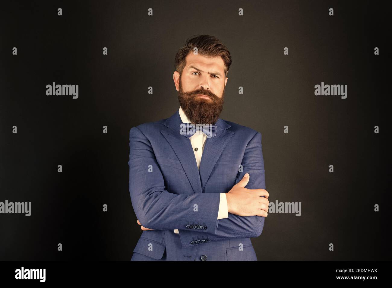 serious bearded man in tuxedo bow tie. bride groom in formalwear on ...