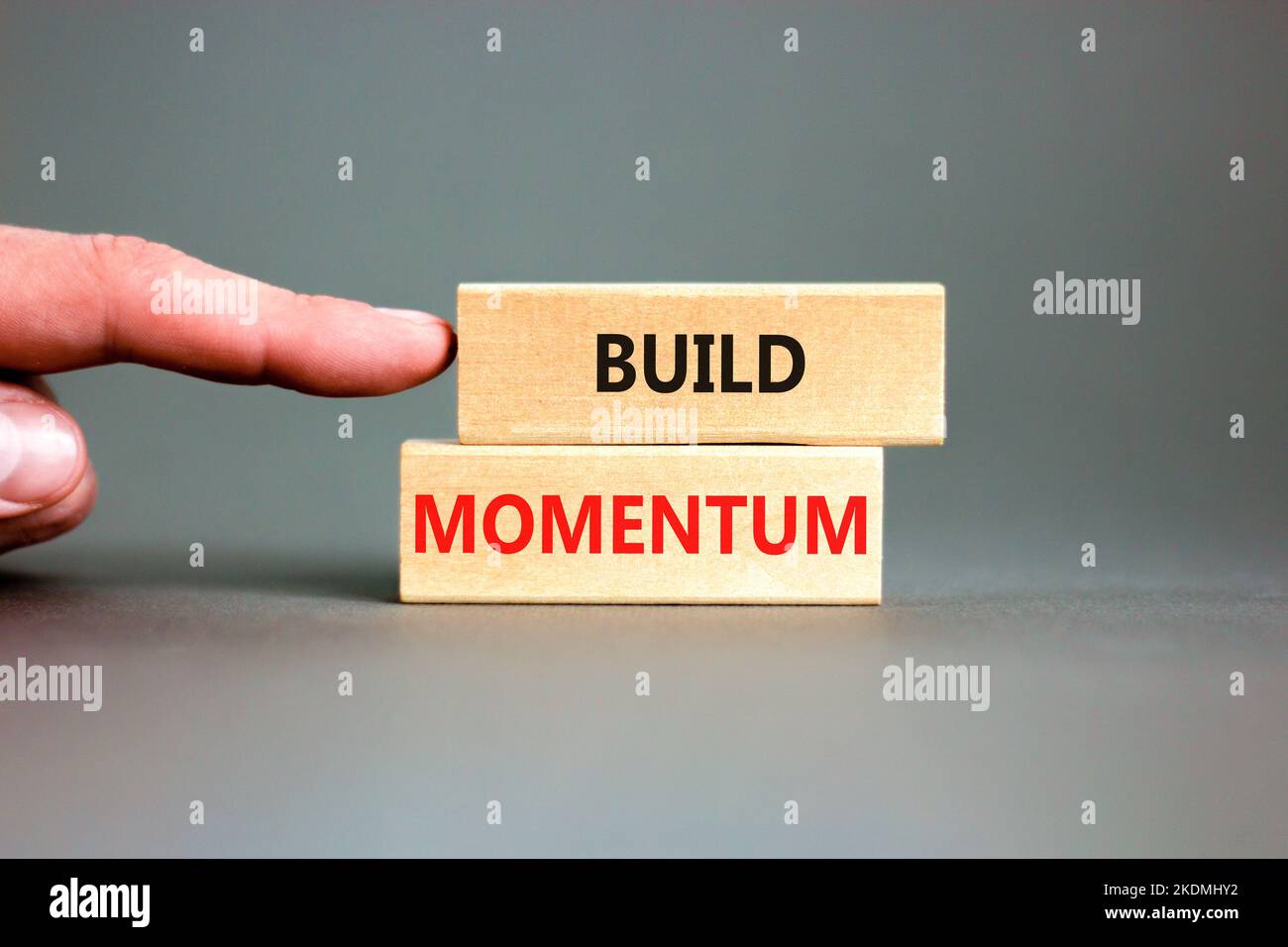 Build momentum symbol. Concept words Build momentum on wooden blocks ...