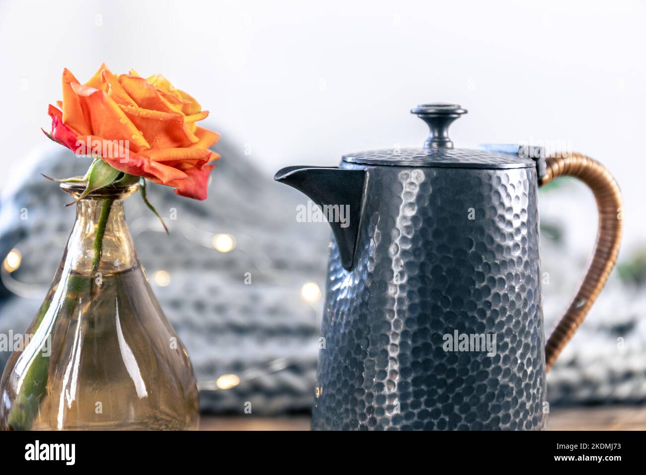 Beautiful textural teapot on a blurred background in a cozy home ...