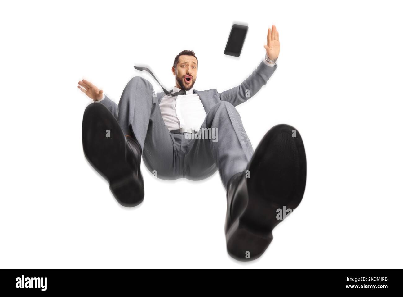 Professional man with a mobile phone falling isolated on white ...