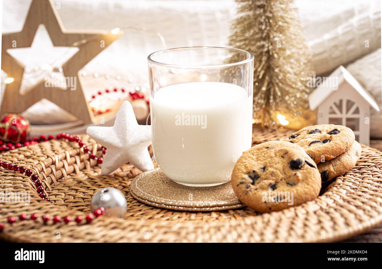 Christmas cookies and glass of milk for Santa on holiday blurred ...