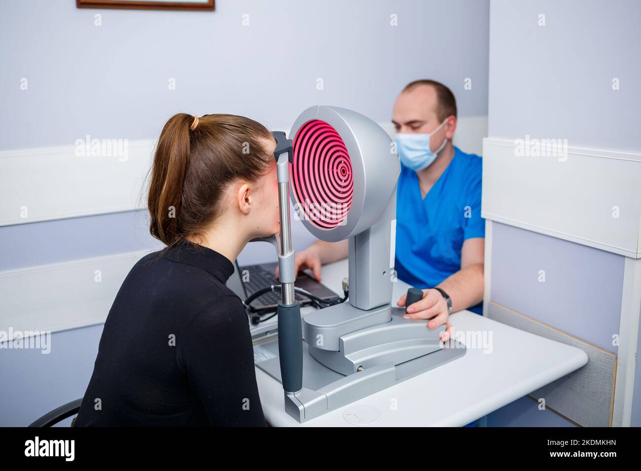 An optometrist at his clinic studies vision. Ophthalmology, medical ...