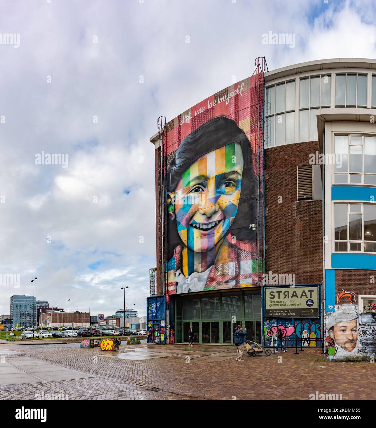 A picture of the Let Me Be Myself colorful mural, depicting Anne Frank ...