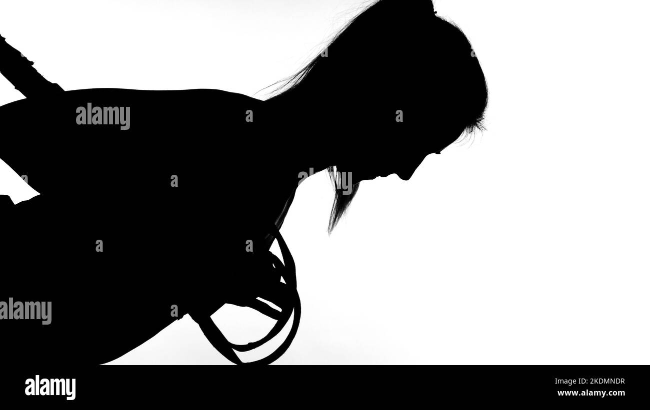 on a white background, a shadow, a black outline of a female figure ...