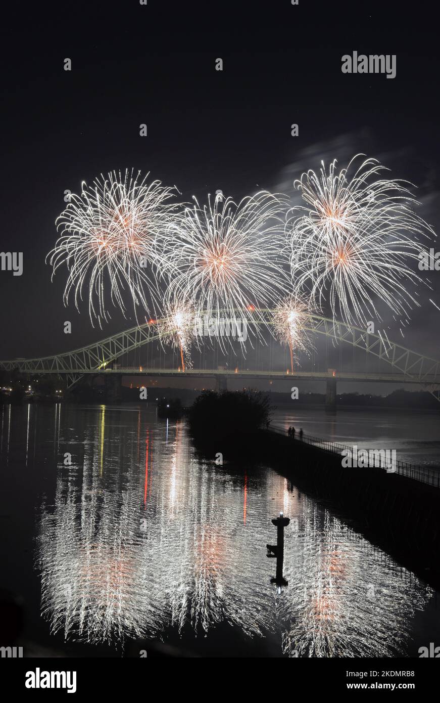 Relections in the Manchester Ship Canal of the exploding fireworks ...
