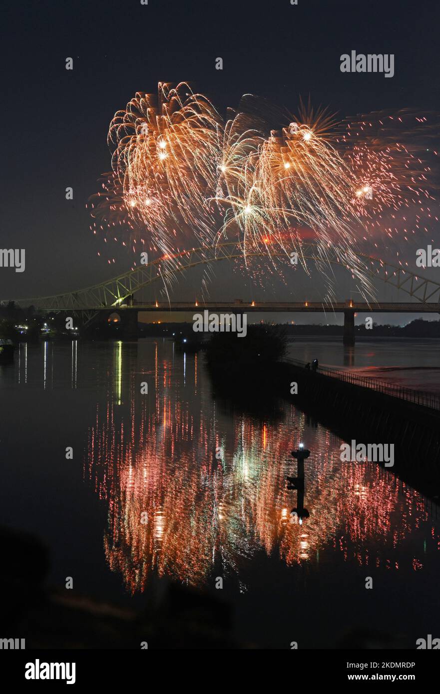 Relections in the Manchester Ship Canal of the exploding fireworks ...