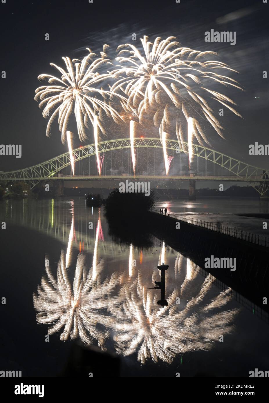 Relections in the Manchester Ship Canal of the exploding fireworks ...
