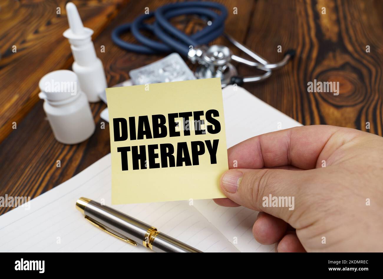 Medical concept. On the table is a notebook, medicines and a ...