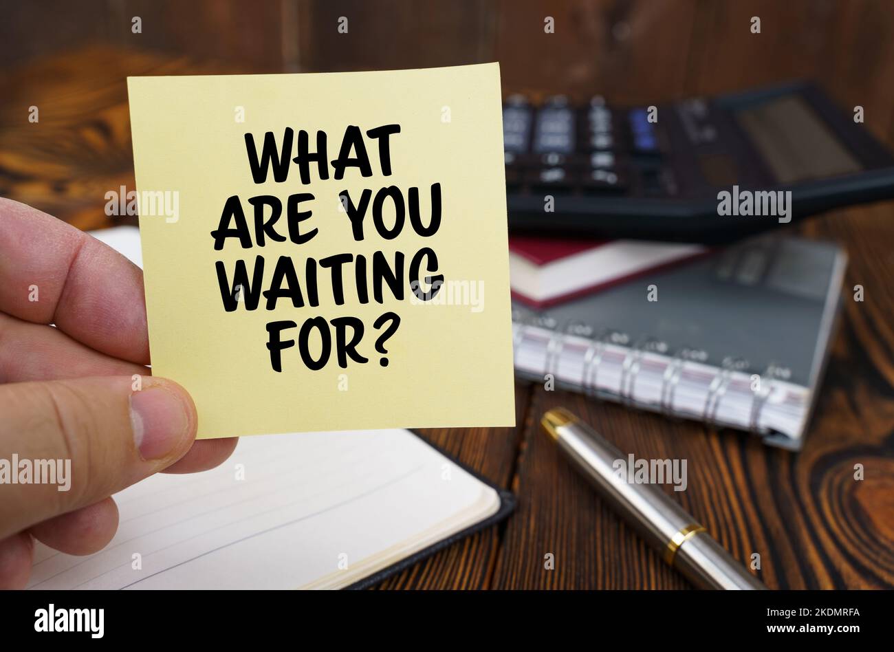 Business concept. In the hands of a man is a sticker with the ...
