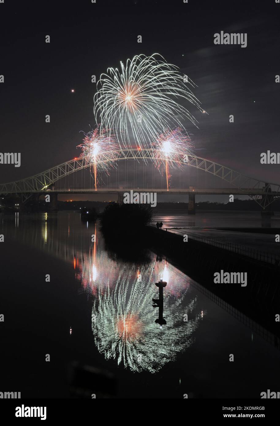 Relections in the Manchester Ship Canal of the exploding fireworks ...
