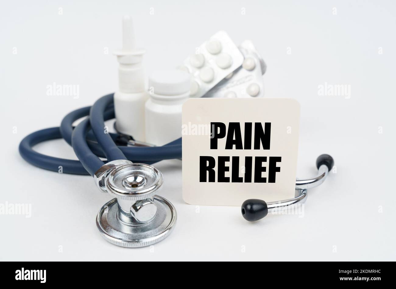 Medical concept. On a white surface, medicines, a stethoscope and ...