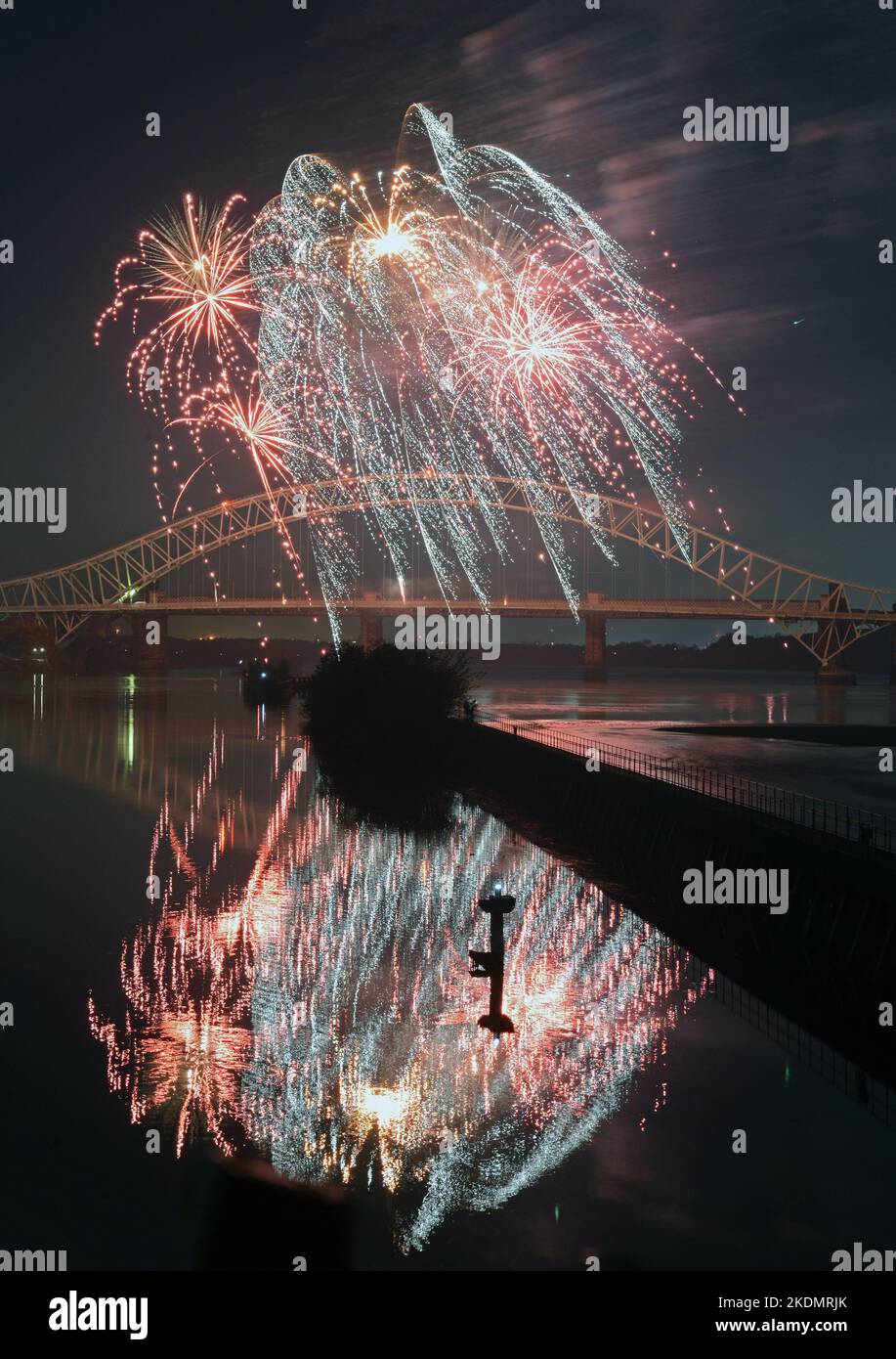 Relections in the Manchester Ship Canal of the exploding fireworks ...