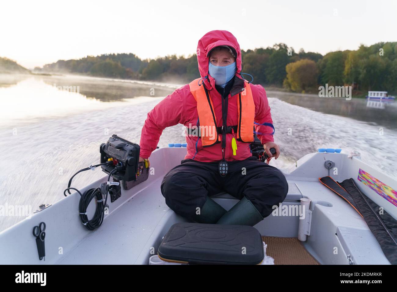 On the river at speed a boat driven by a fisherman. Water transport ...