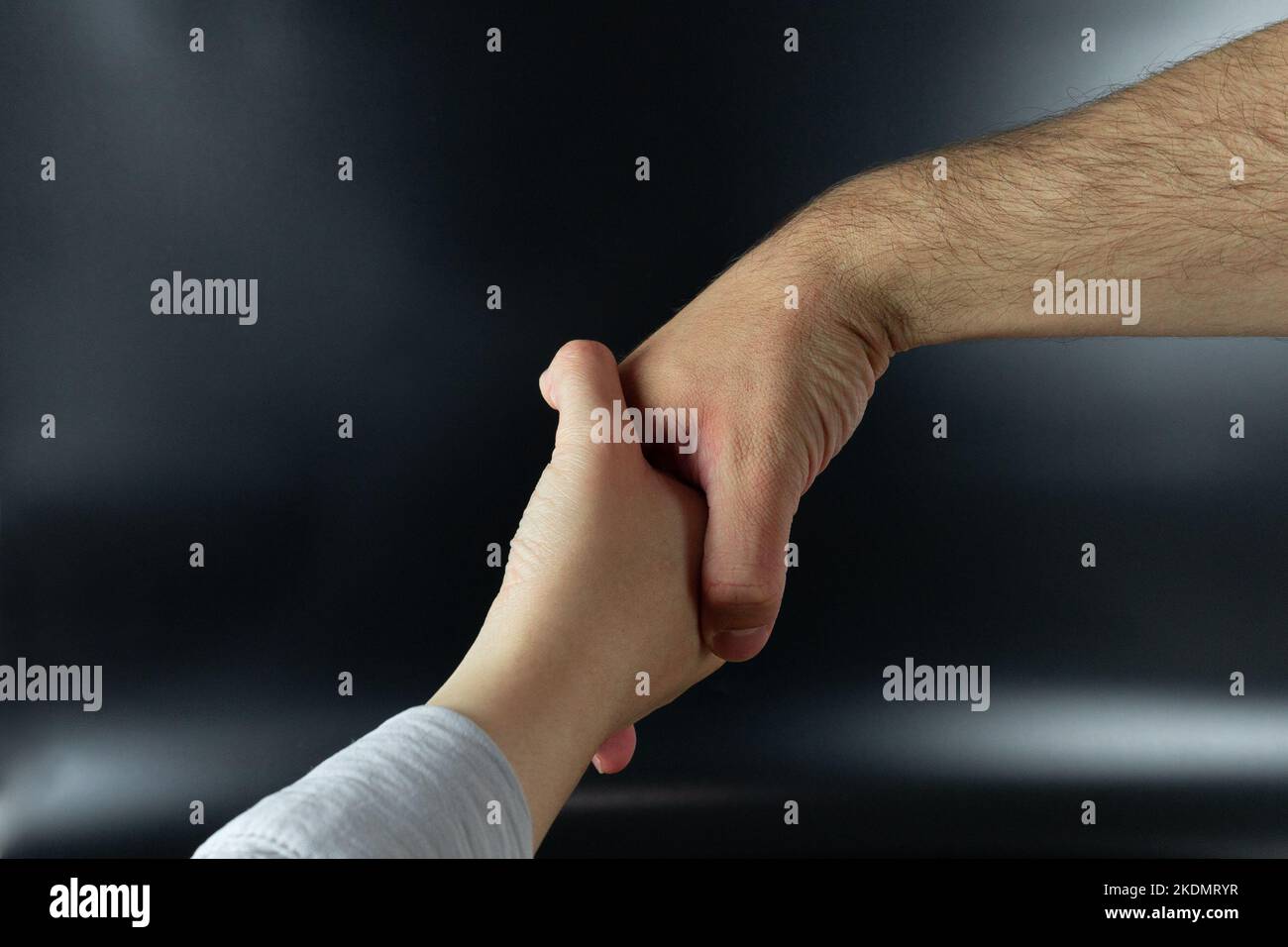Human hands making a deal isolated on background. Male and female ...