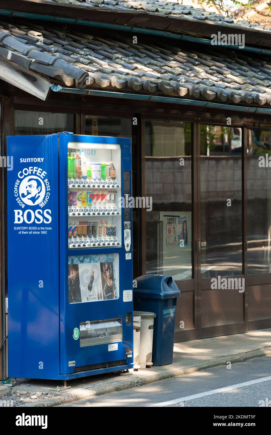 A Boss Coffee vending machine, offering soft drinks, juices, and cold ...