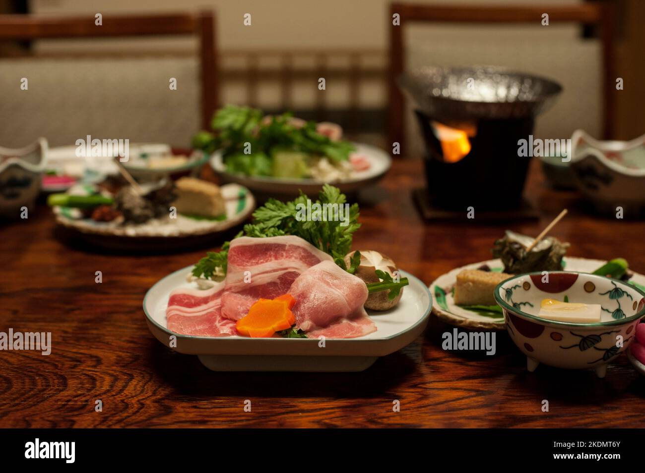 A traditional Japanese meal at a ryokan, featuring pork shabu shabu and ...
