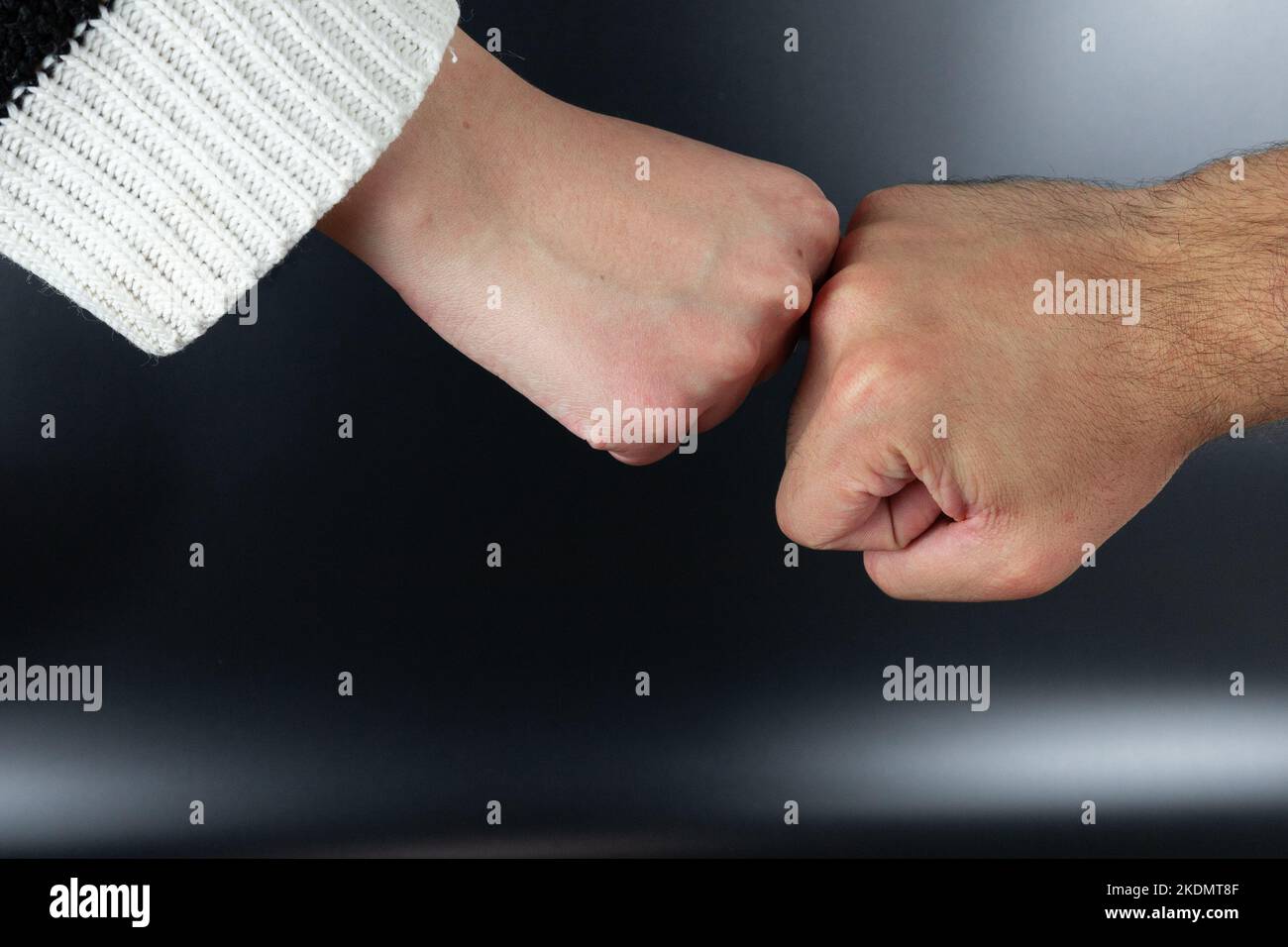 Human hands making a deal isolated on background. Male and female hands ...