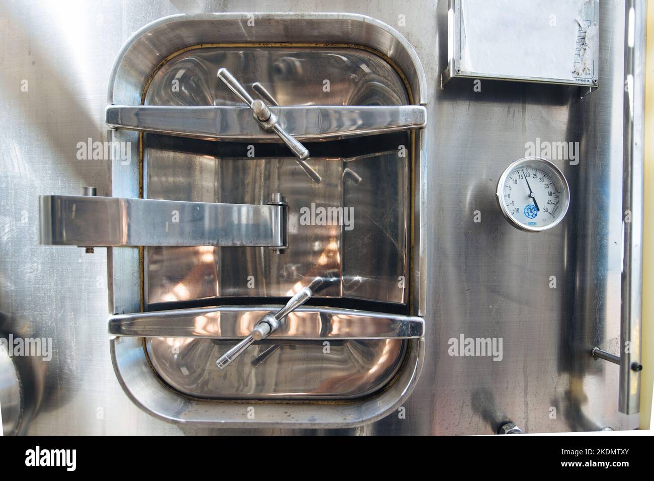 Thermometer or pressure gauge on fermentation vat in modern winery ...
