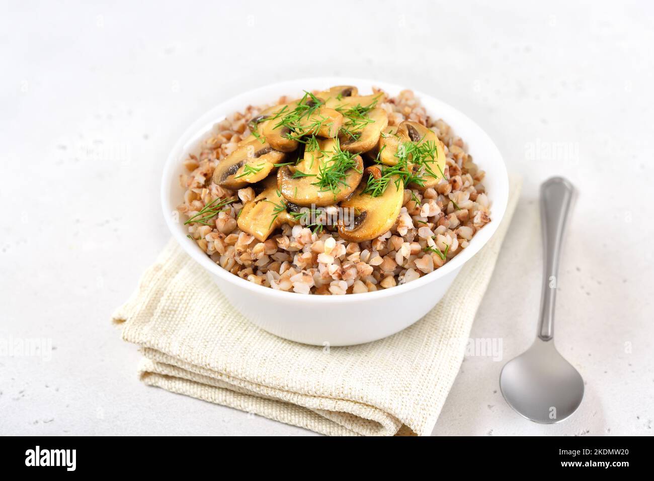 Buckwheat porridge with roasted mushrooms in white bowl Stock Photo - Alamy