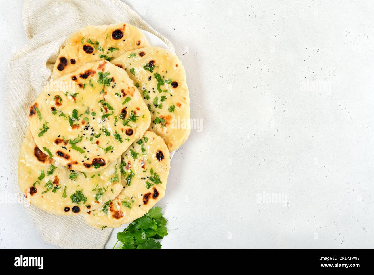 Indian naan bread over light background with copy space. Top view, flat ...