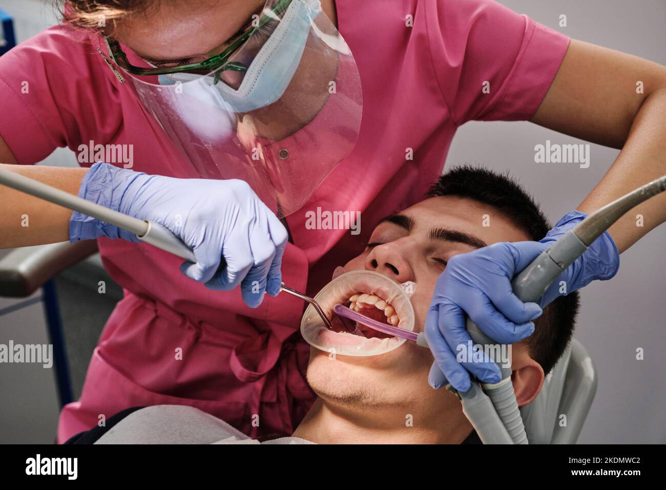 Top view of the process of brushing the patient's teeth. Brushing teeth ...