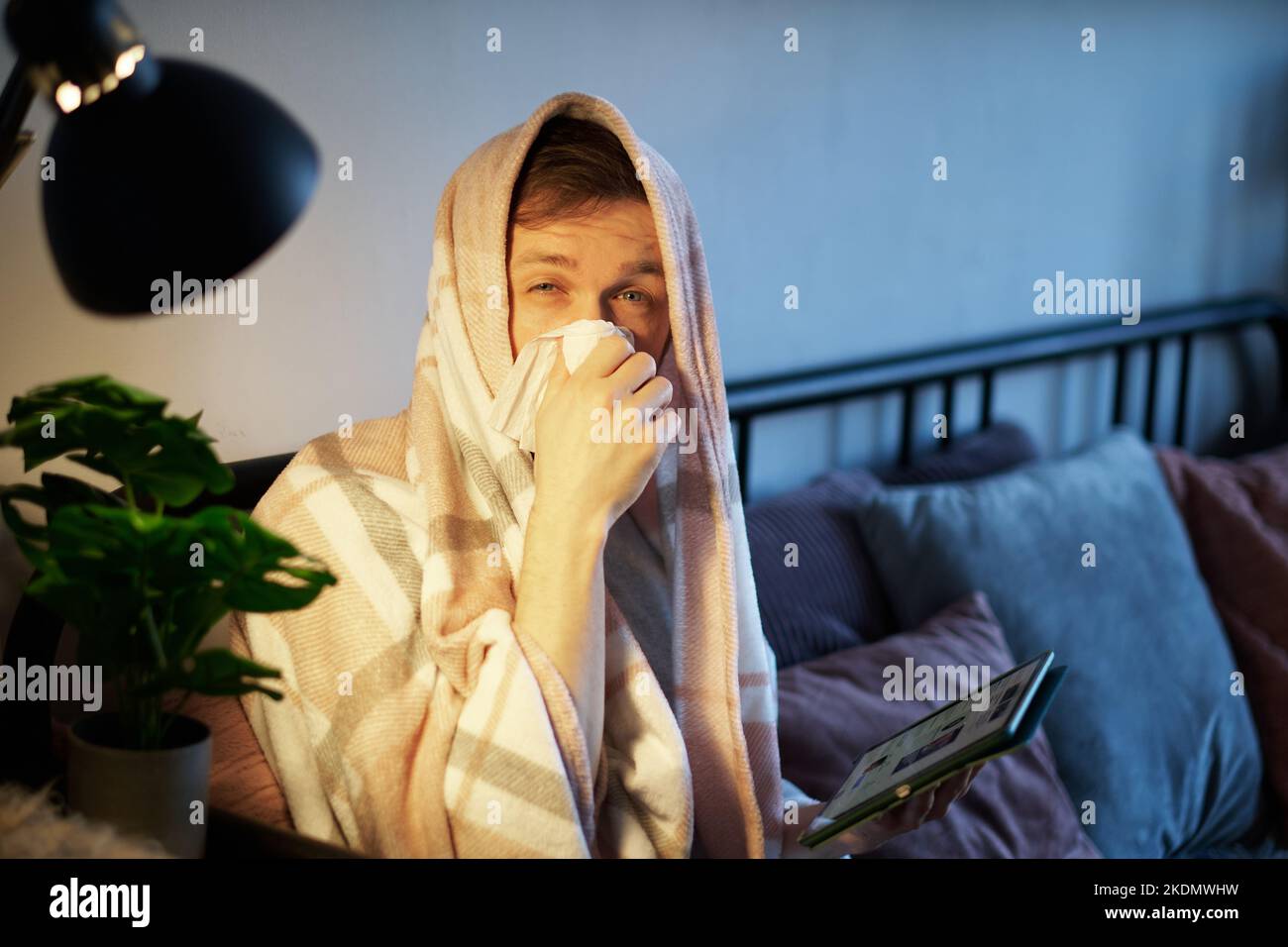 Feeling sick or illness concept. Distant work from home office or ...