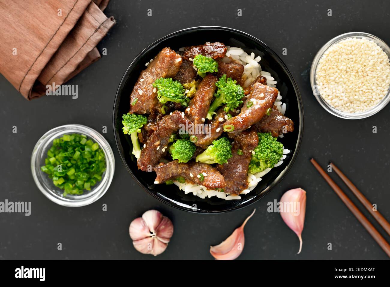 Beef stir-fry with broccoli on black stone background. Top view, flat ...