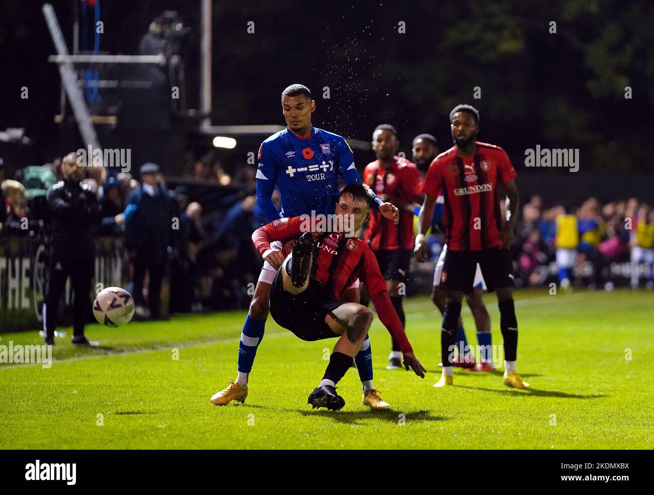 Bracknell Town’s George Knight attempts to clear the ball under ...