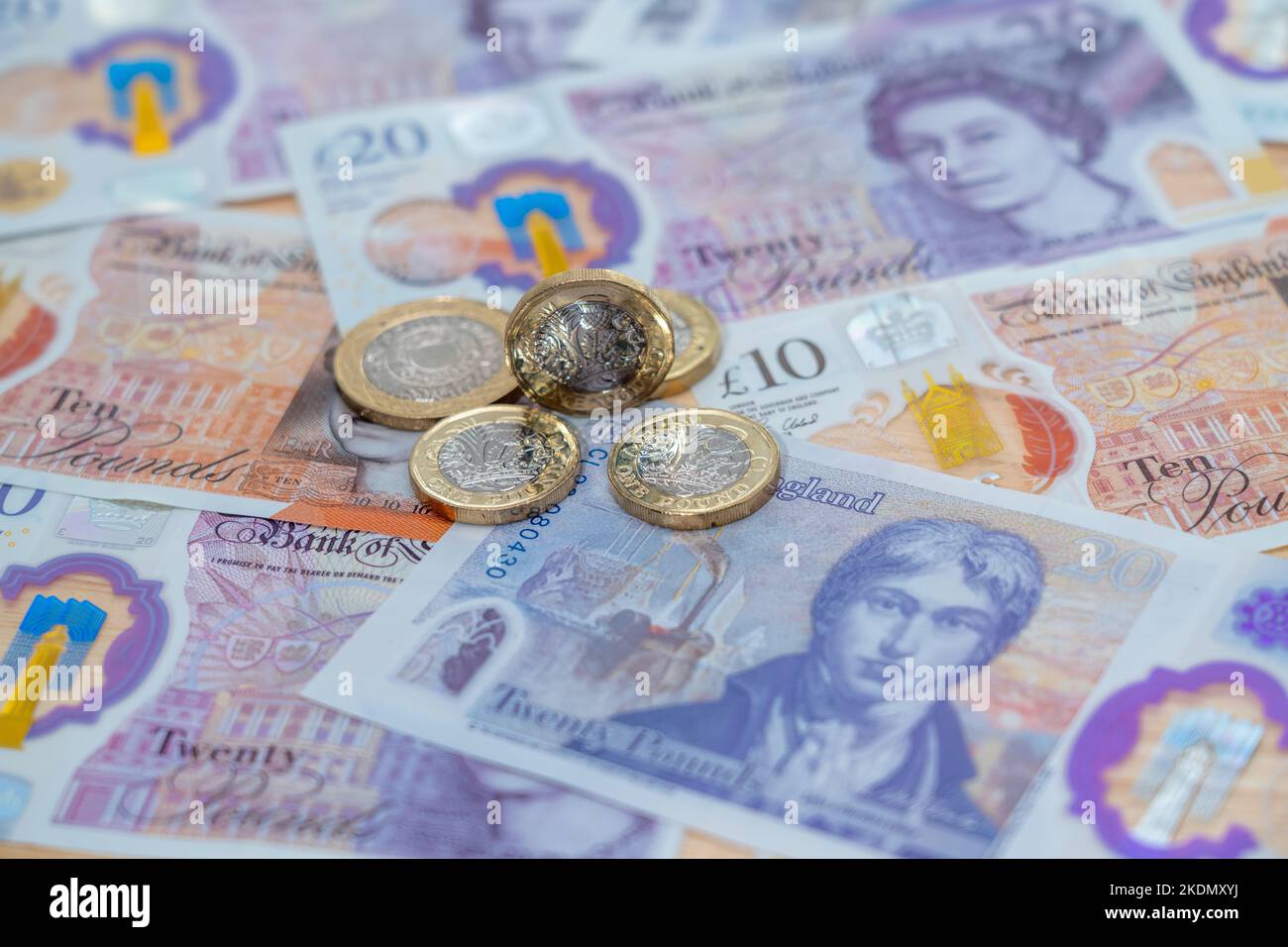 Coins placed on banknotes - UK Stock Photo - Alamy