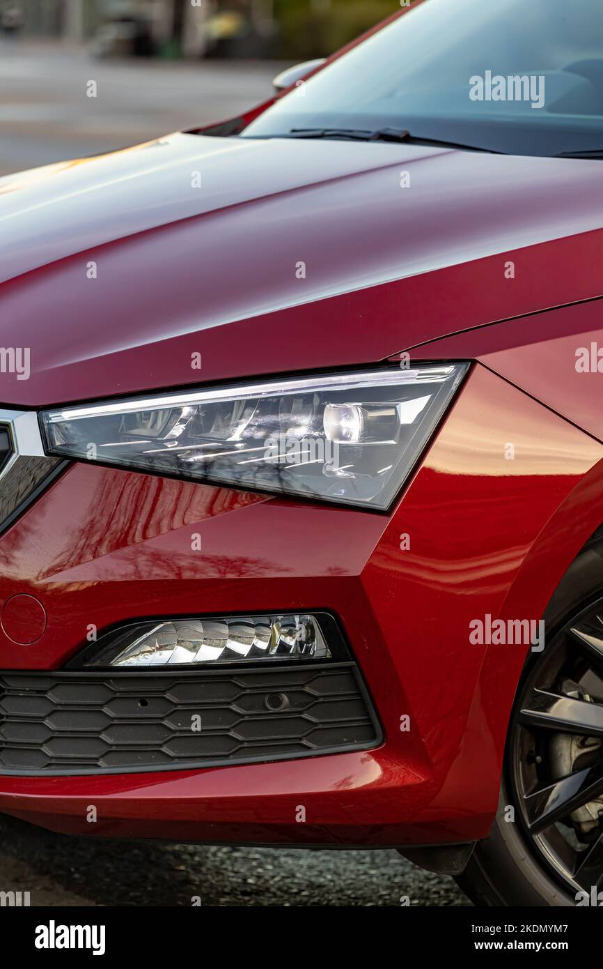 Headlights and fog lights of the red car. vertical Stock Photo - Alamy