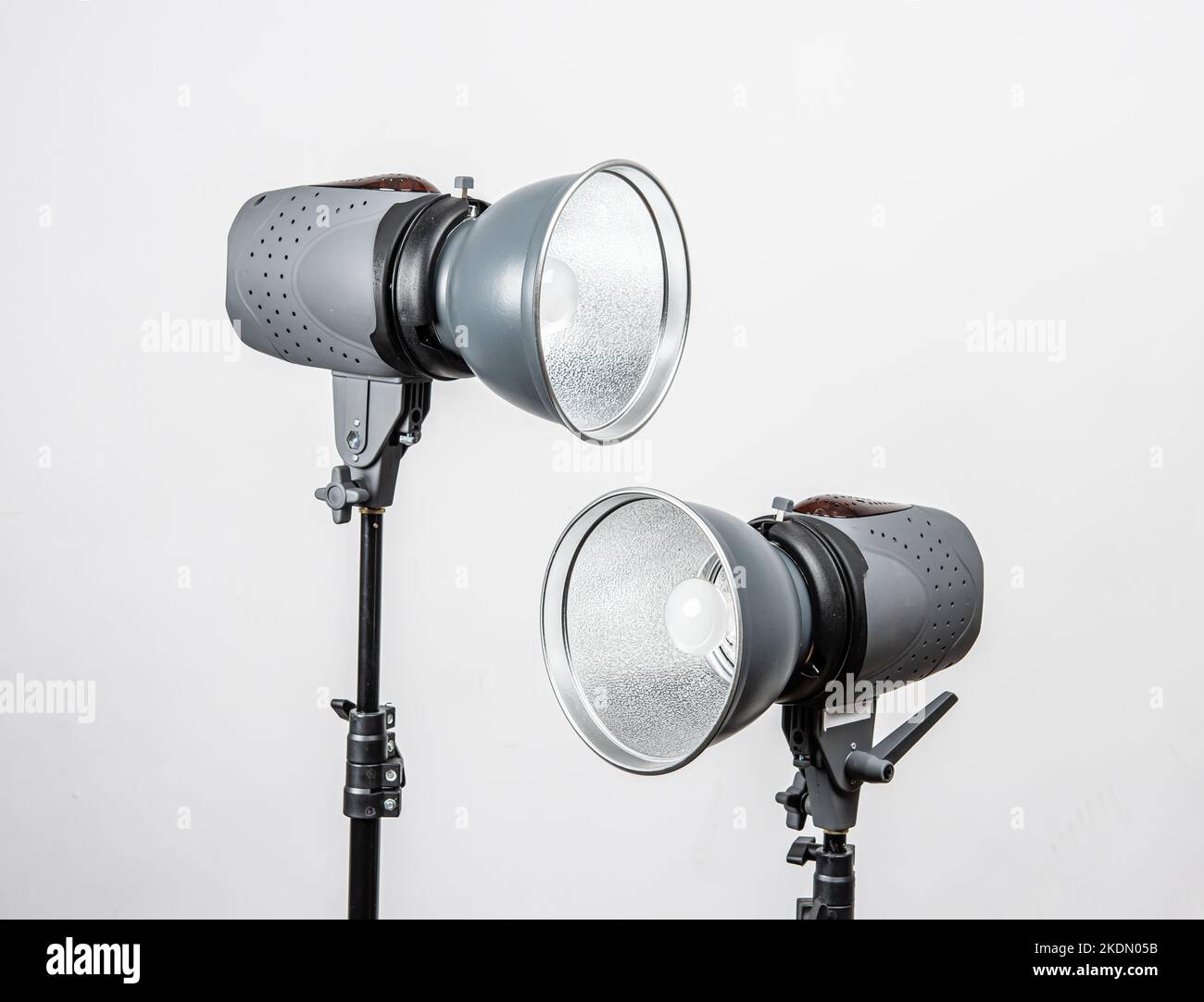 Two studio strobe lights on light stands Stock Photo - Alamy