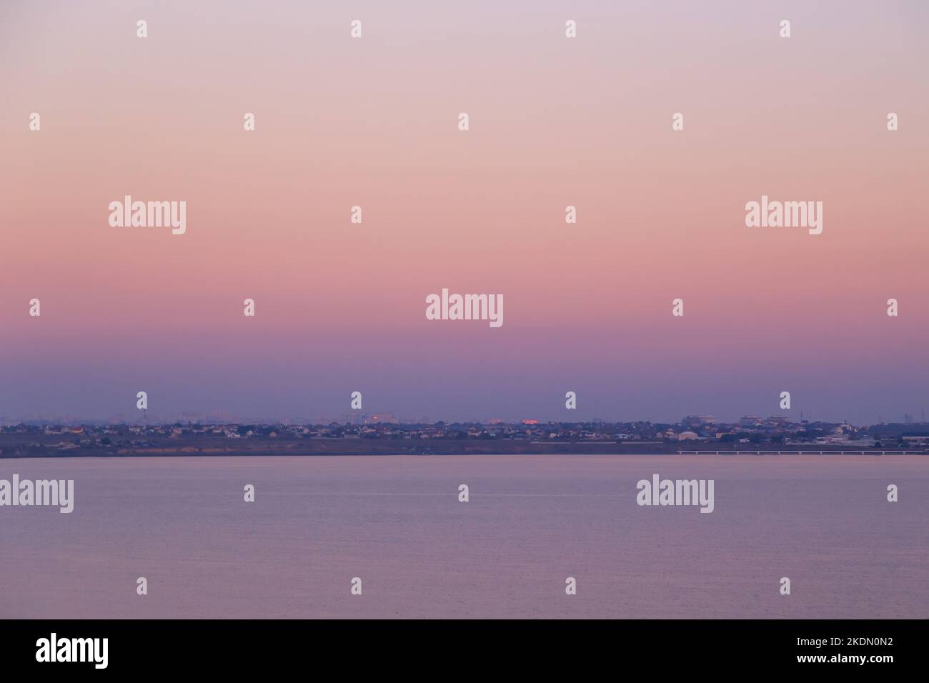 Stunning pink sunset over the lake, sunset background. Khadzhibey ...