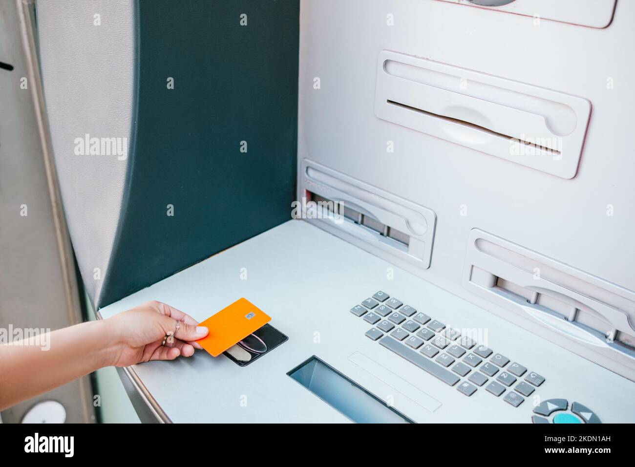 From above anonymous female holding blank credit card over contactless ...