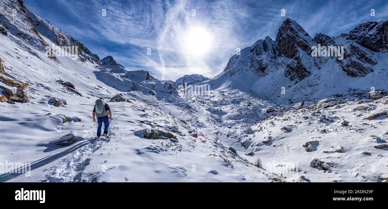 Trekking scene in winter on the italian alps Stock Photo - Alamy