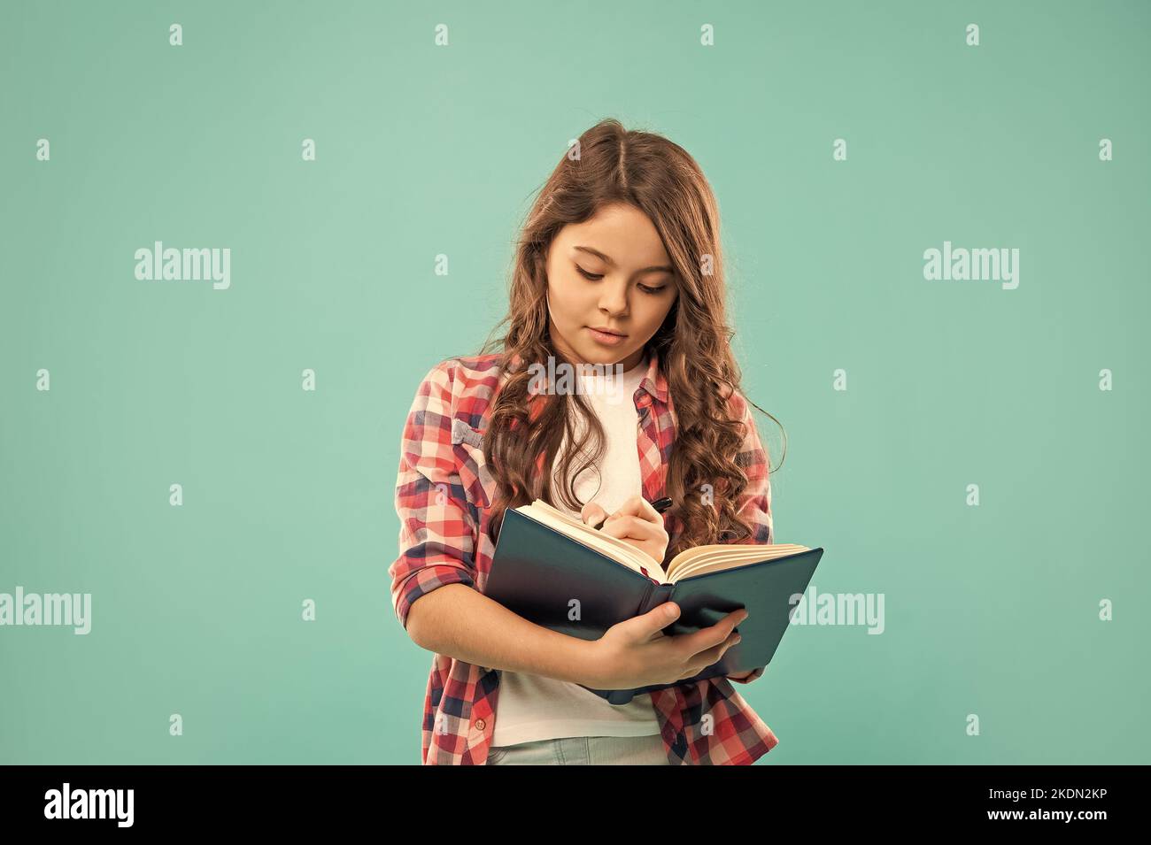 busy child making notes on blue background, knowledge Stock Photo - Alamy