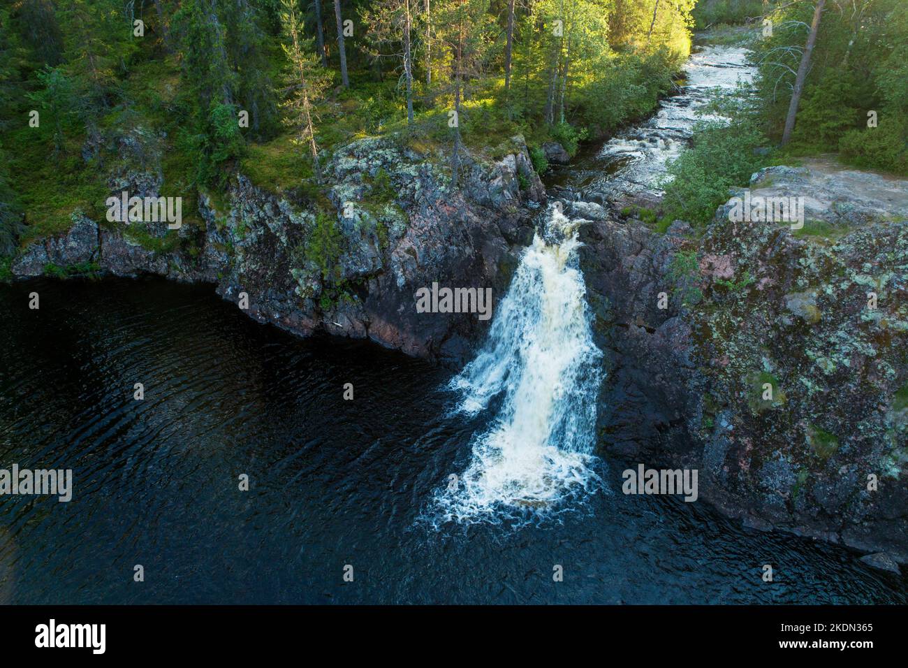 Beautiful Komulanköngäs waterfall on a summer evening. Shot near ...