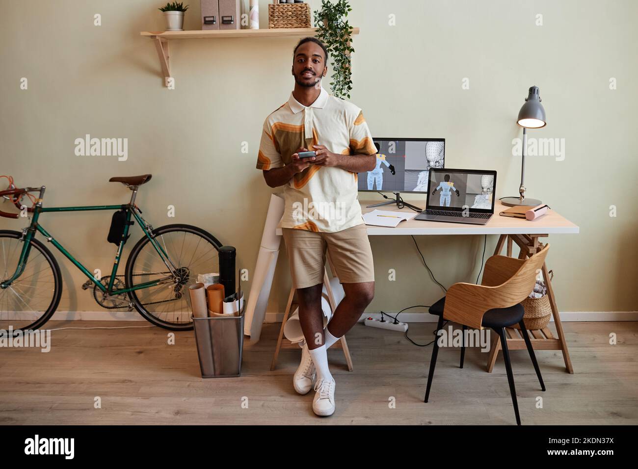 Full length portrait of young black man as digital 3D designer using ...