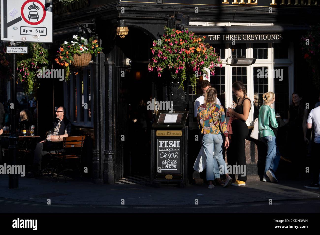 Afternoon drinkers, enjoying the sunshine outside, The Three Greyhounds ...