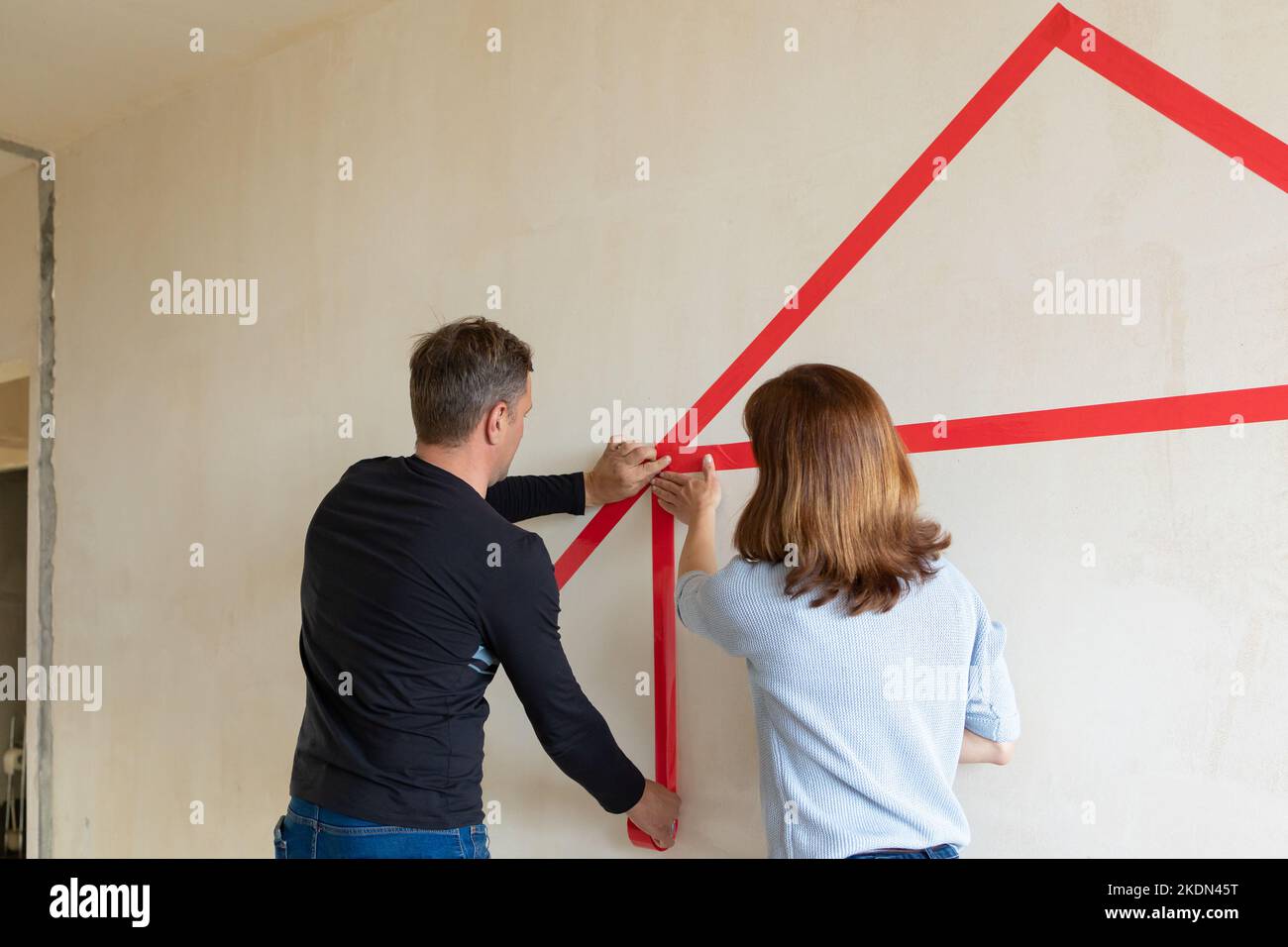 Man hugging his wife. Young couple moving in new apartmen. Concept new ...