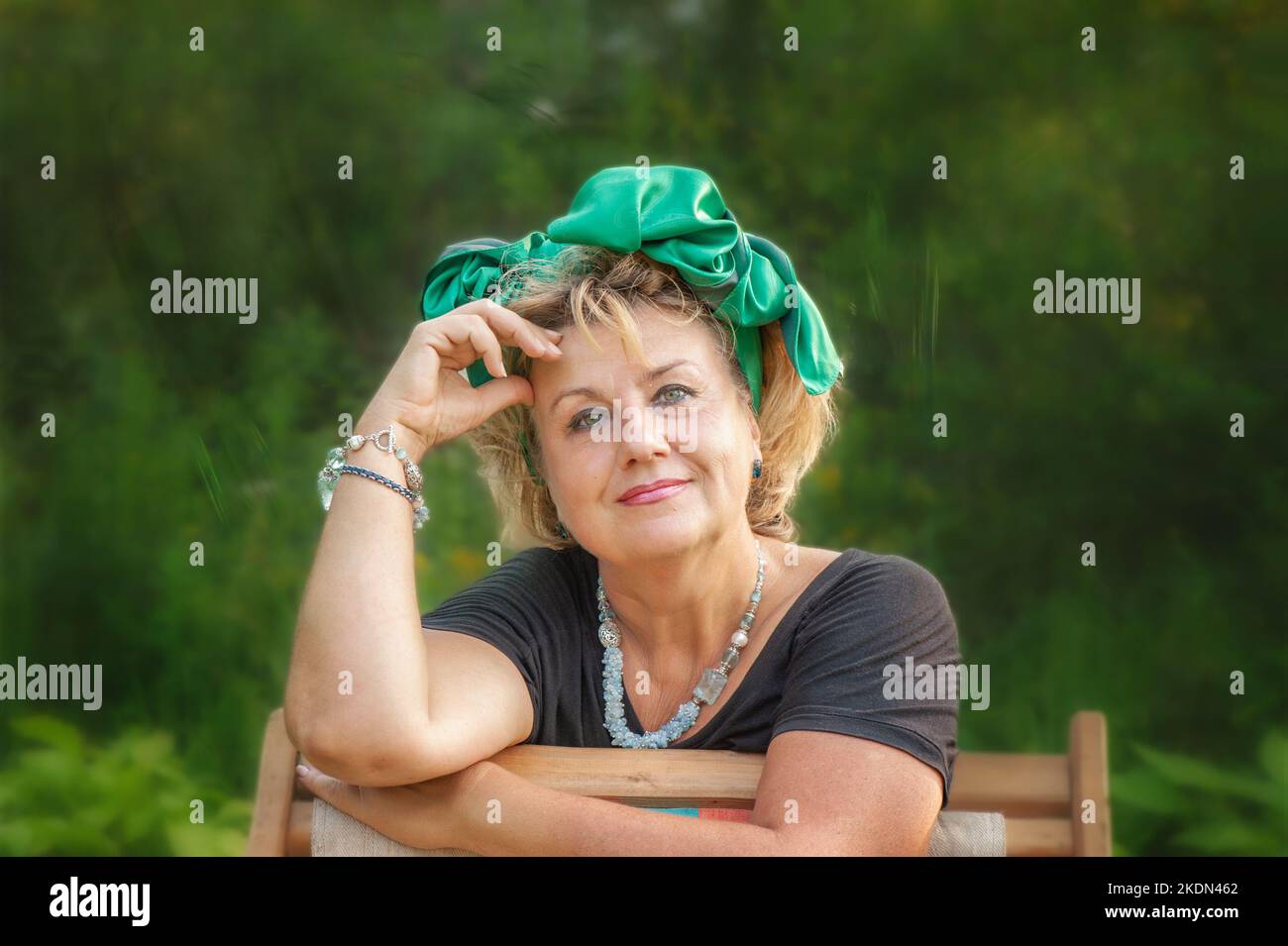 55-60-year-old woman. A beautiful fashionable smiling mature woman in a ...