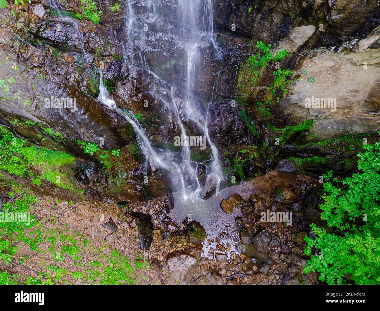 waterfall in deep mountain with large rocks Stock Photo - Alamy