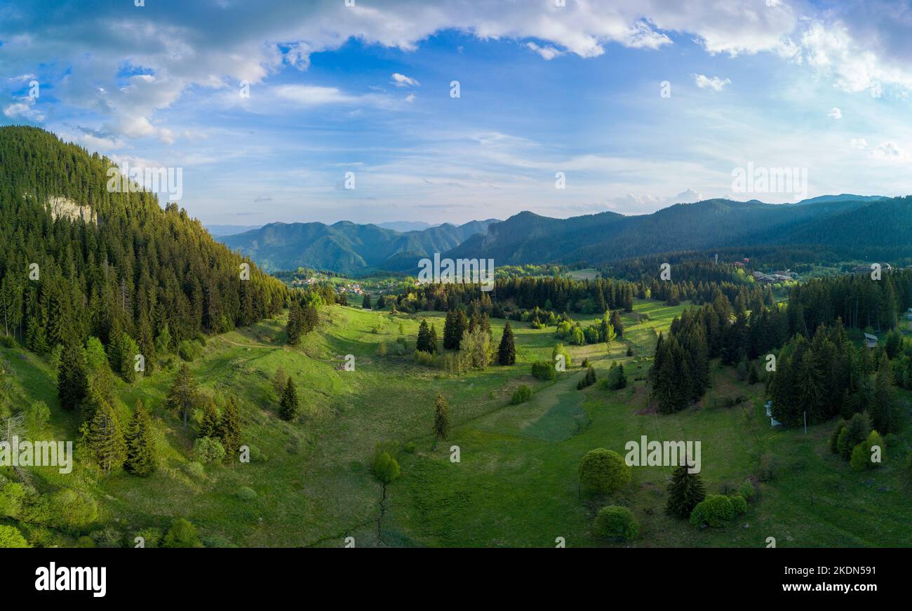 Valley of Balkan mountains is covered with fog, sunny clouds and ...