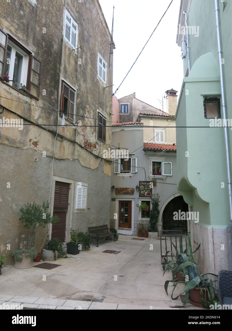 In the medieval maze of old town Cres, the narrow streets open out into ...