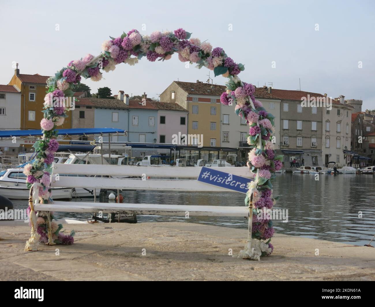 #visitcres: a garland of flowers over a bench to sit on frames the view ...