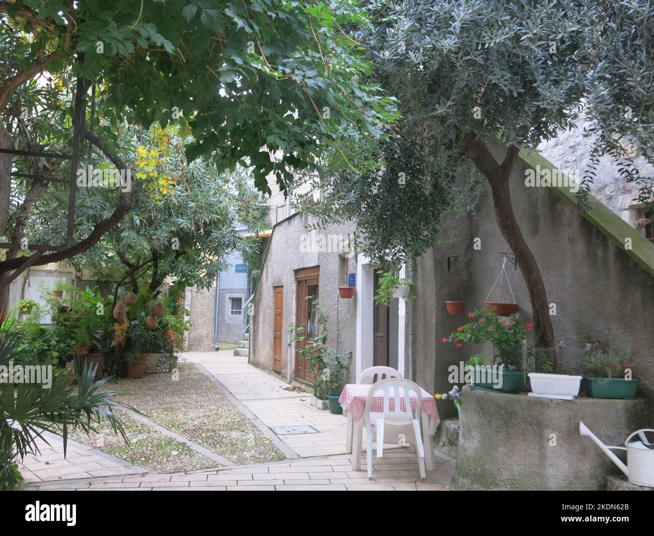 In the medieval maze of old town Cres, the narrow streets open out into ...